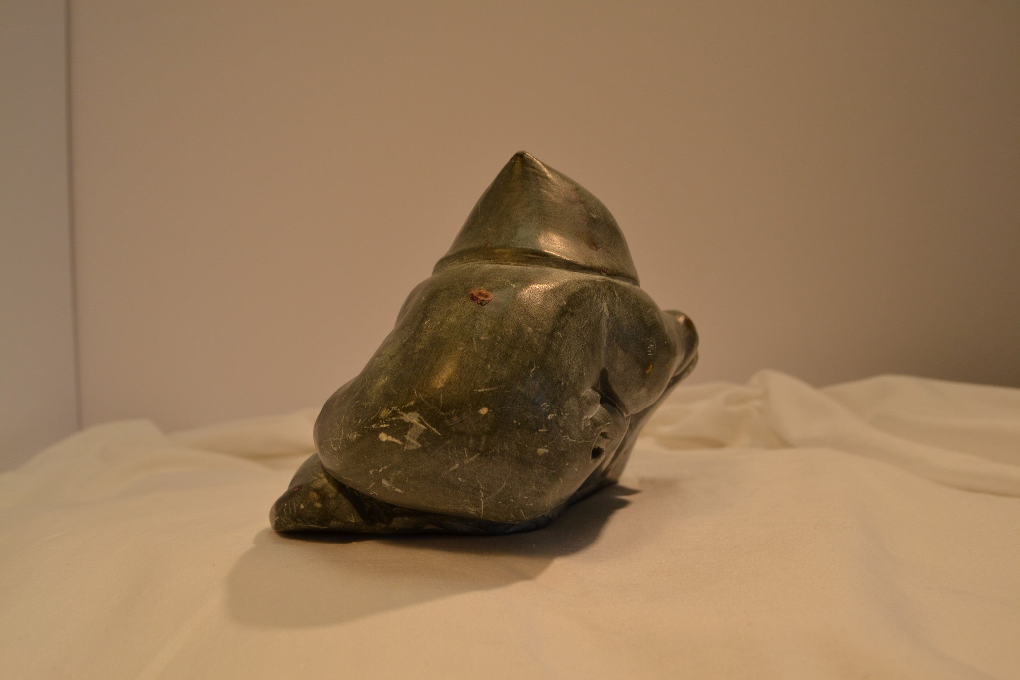 Hunter stalking ringed seal Inuit Carving | Langford Gallery