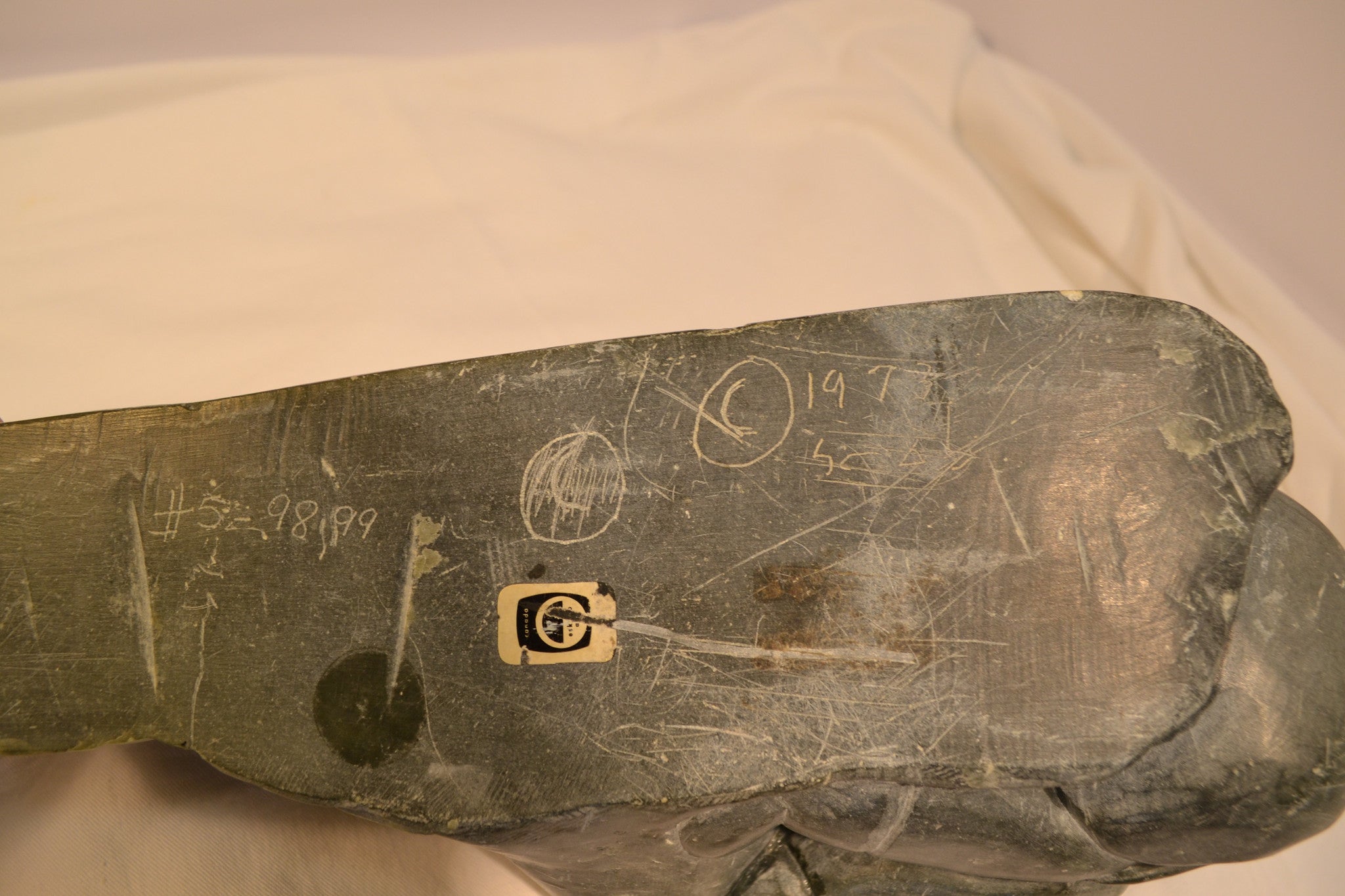 Hunter stalking ringed seal Inuit Carving | Langford Gallery