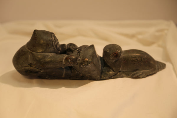 Hunter stalking ringed seal Inuit Carving | Langford Gallery